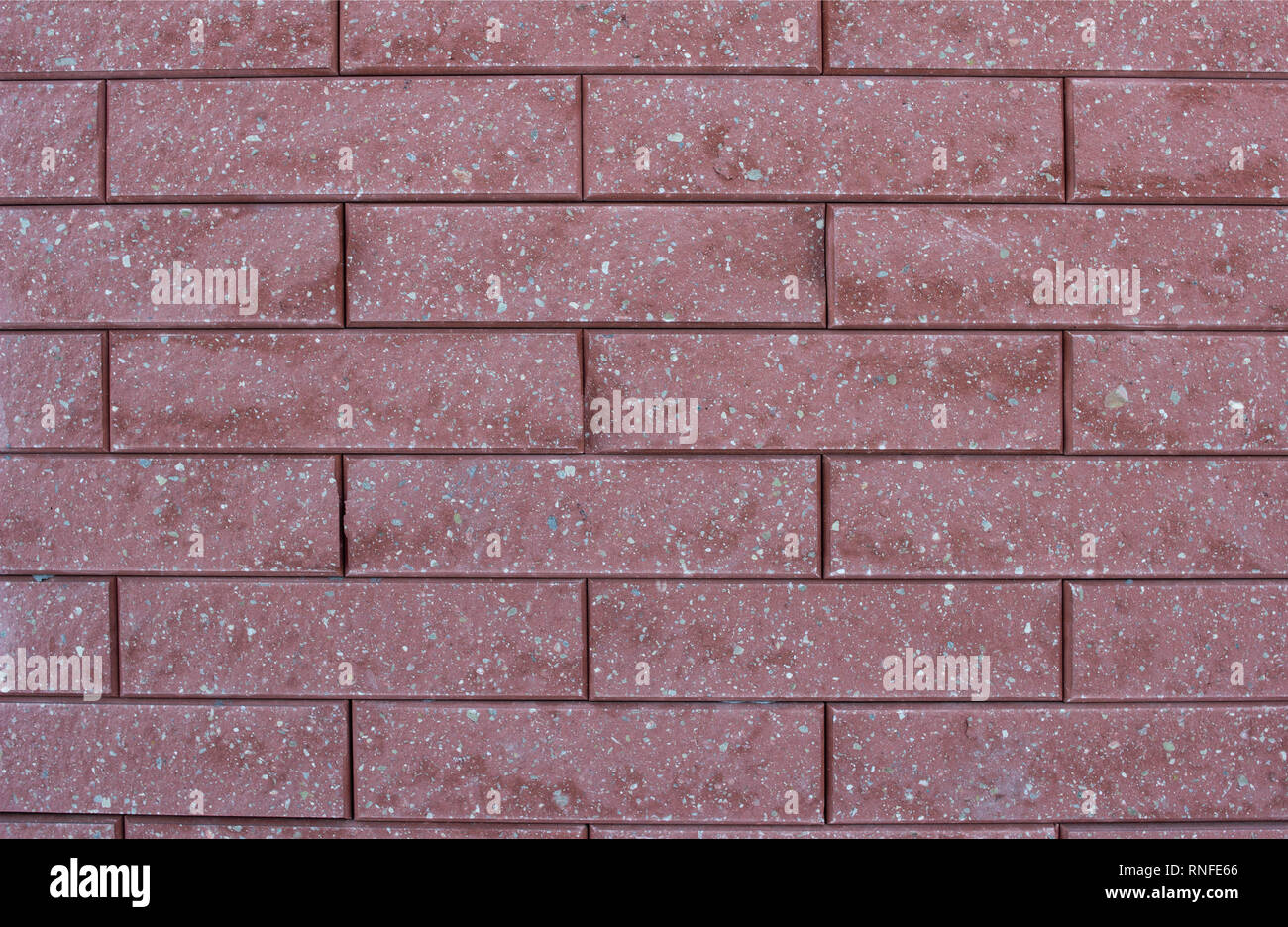 Texture of modern red brick wall with small stones, background ...