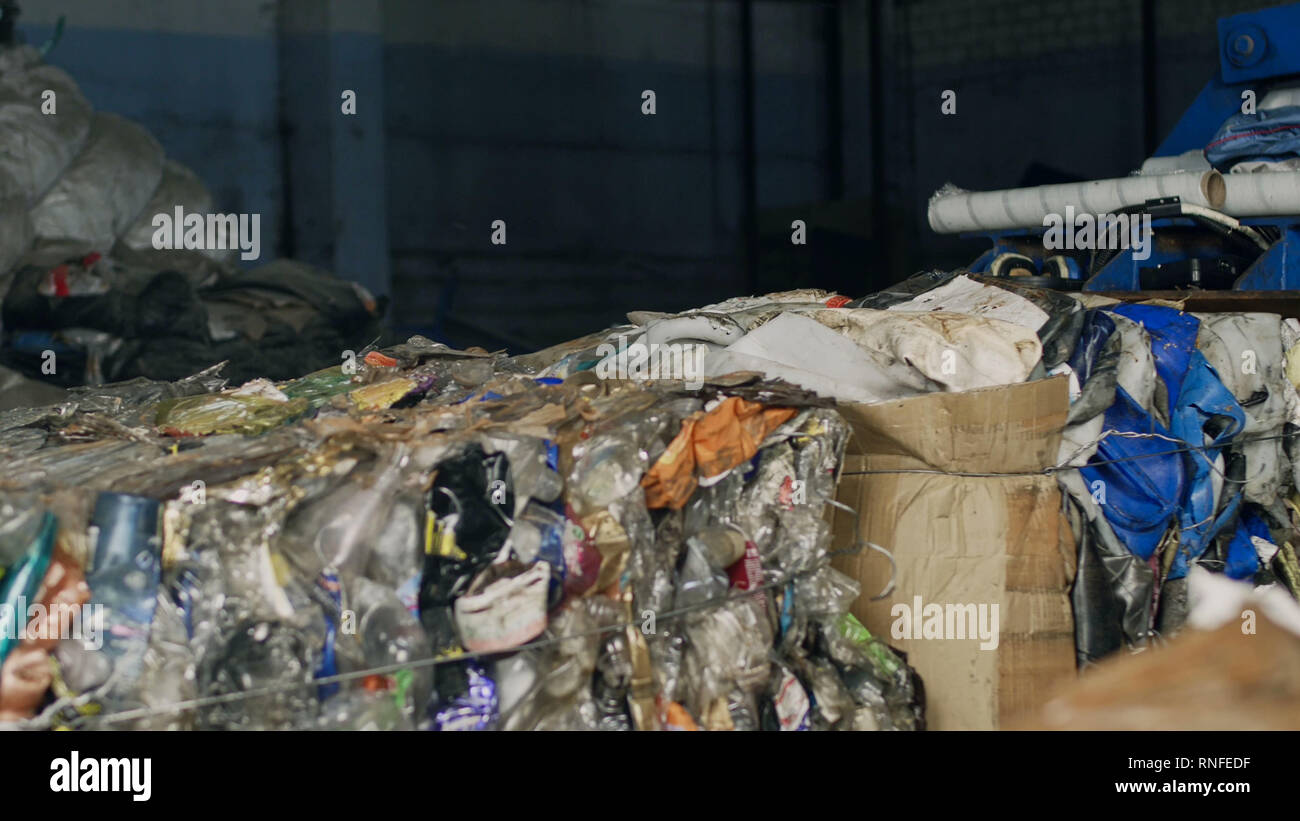 Recycling plant, pressing garbage on special equipment in bales ...