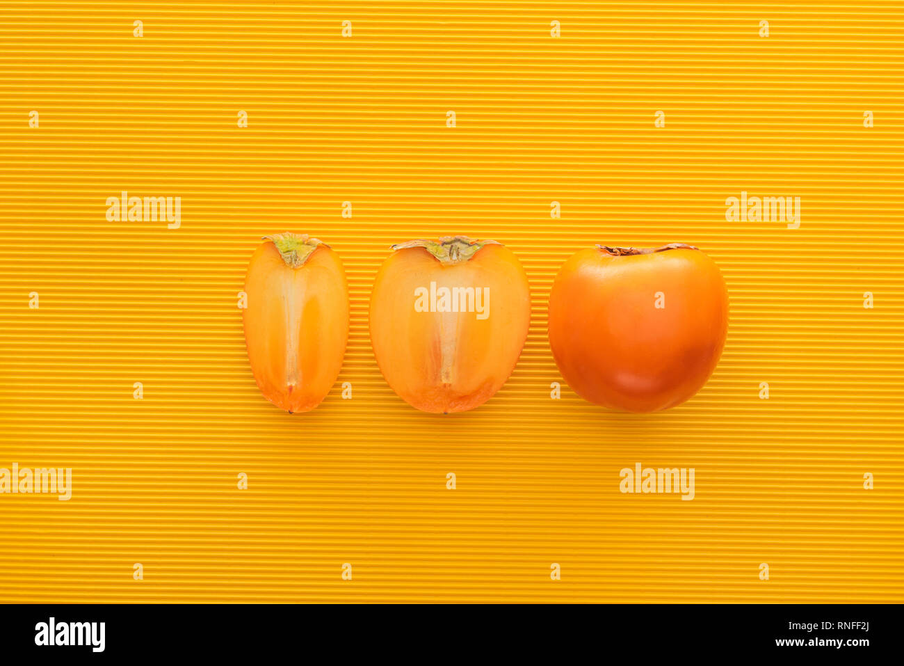 Top view cut persimmons hi-res stock photography and images - Alamy