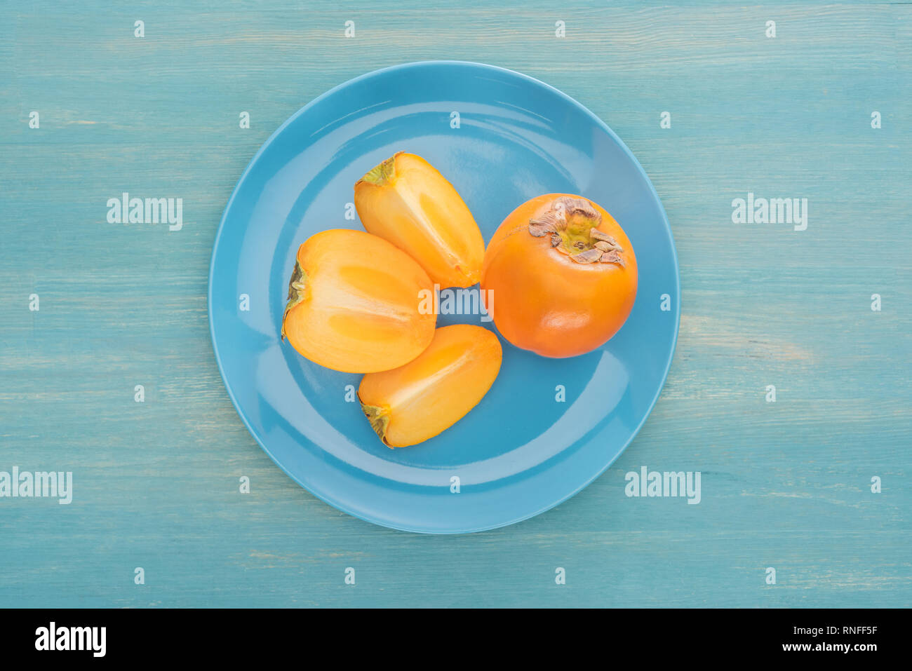 Top view cut persimmons hi-res stock photography and images - Alamy