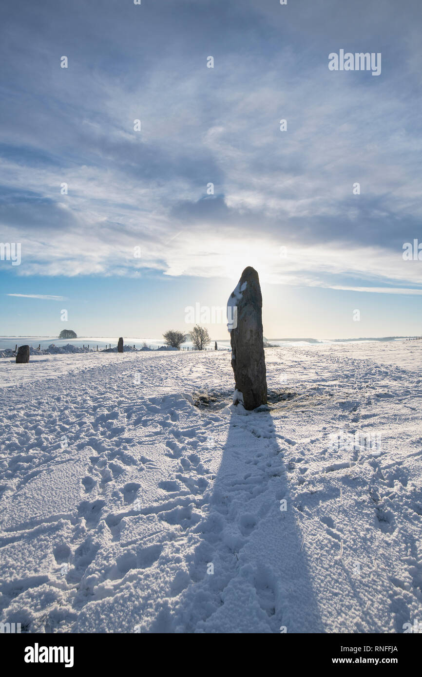Avebury stone circle in the winter snow just after sunrise. Avebury ...