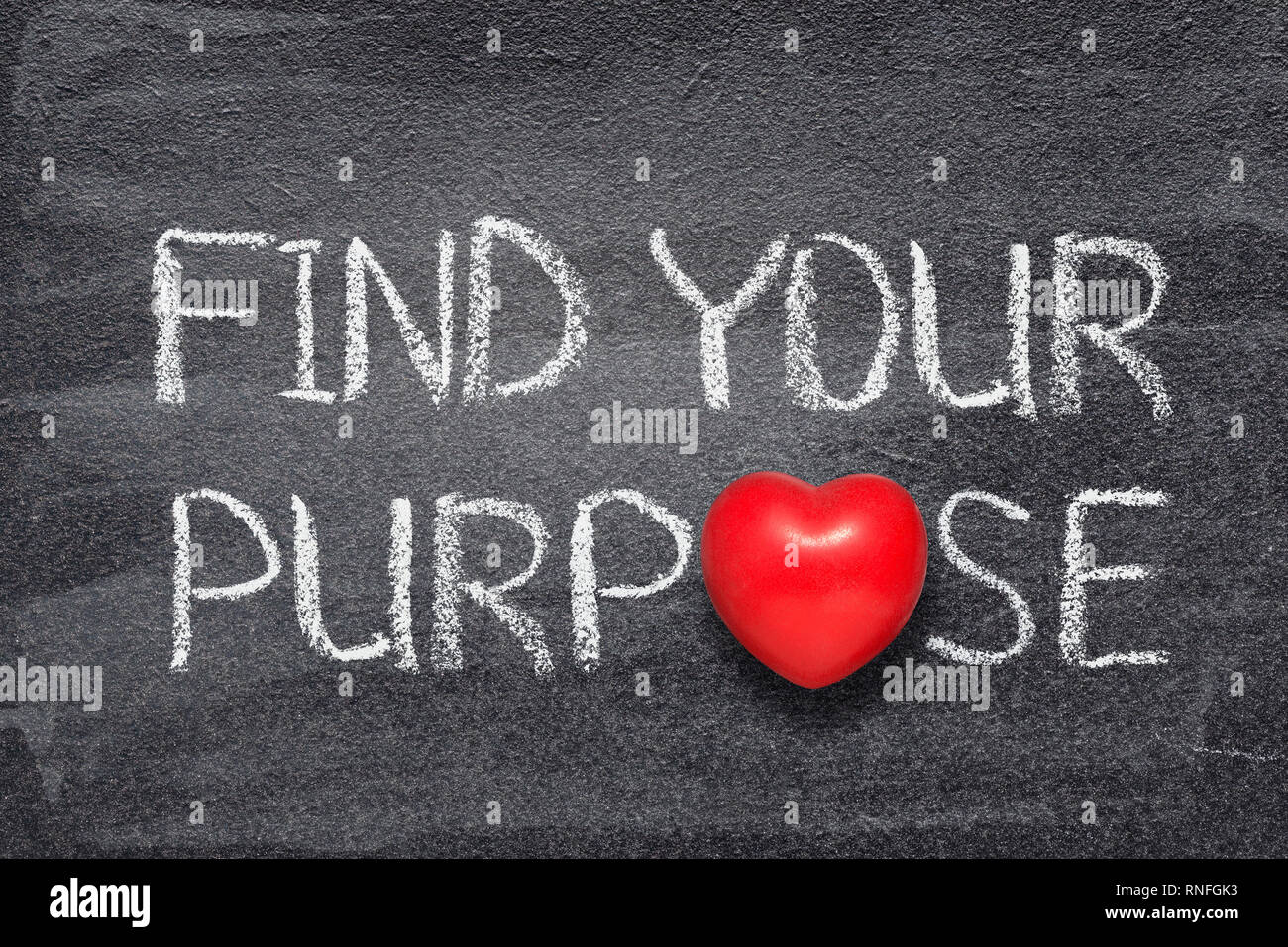 find your purpose phrase handwritten on chalkboard with red heart ...