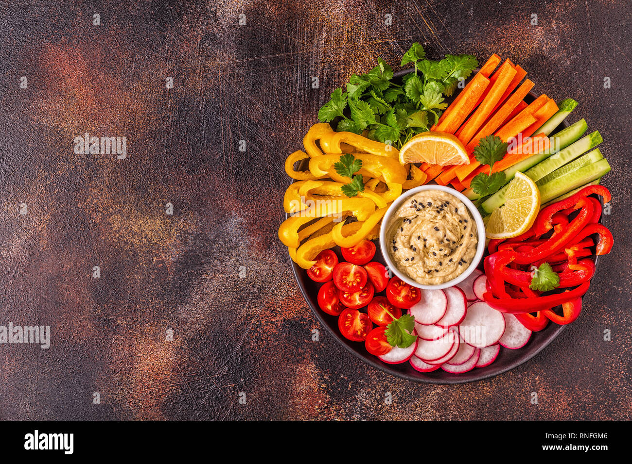Homemade hummus with fresh vegetables, top view Stock Photo - Alamy