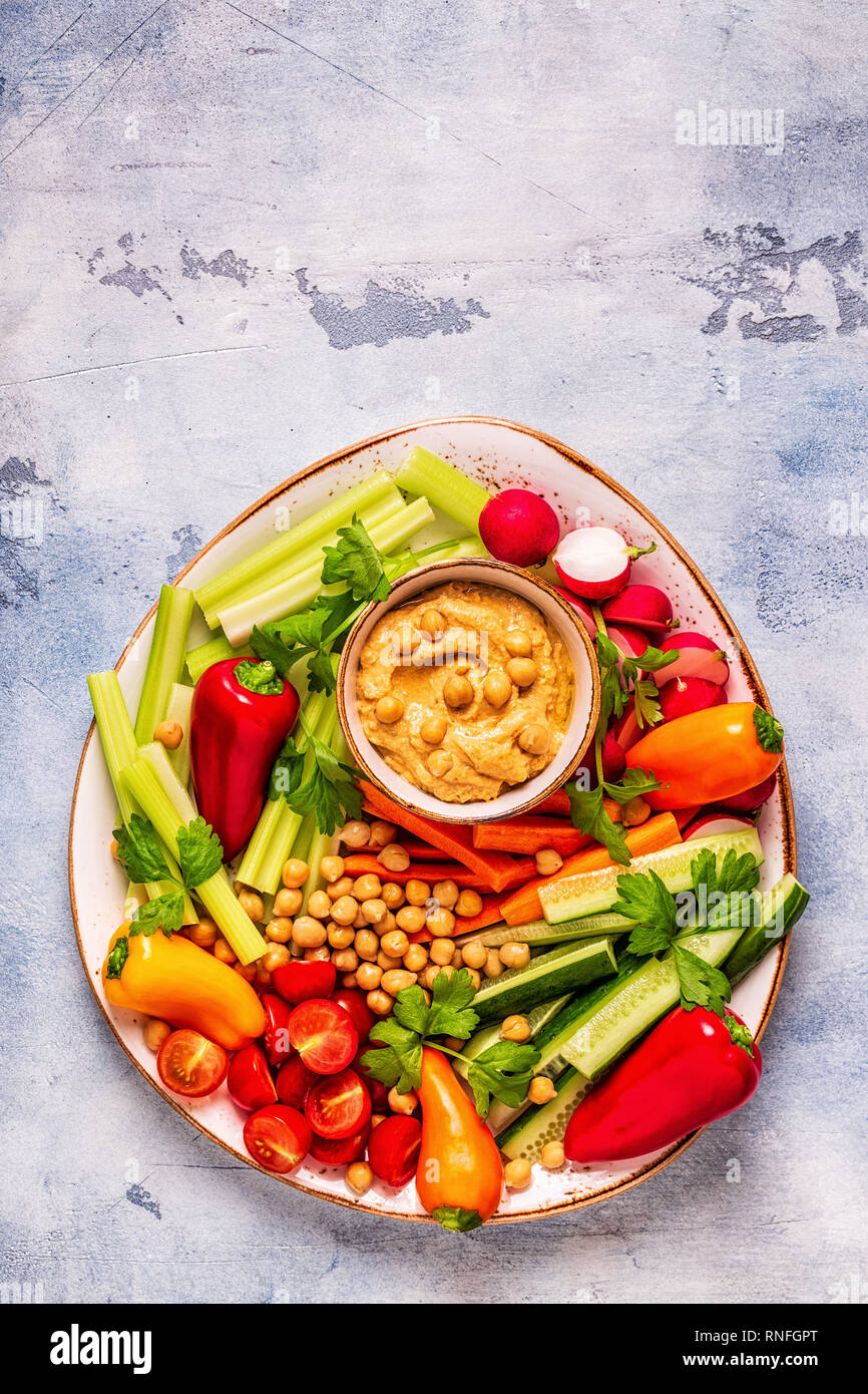 Hummus with various fresh raw vegetables, top view Stock Photo - Alamy