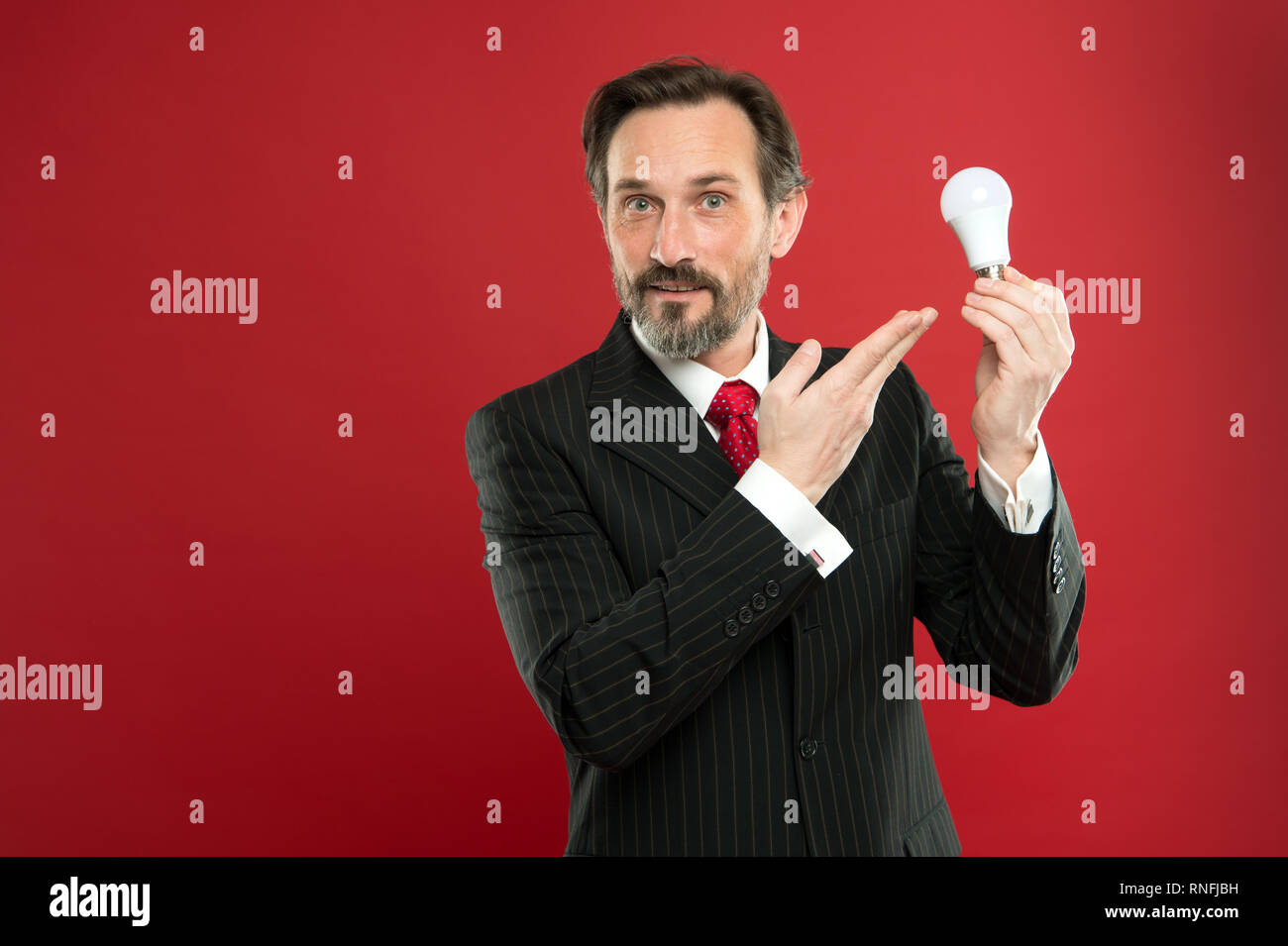 Light up your business. Man bearded businessman formal suit hold light ...