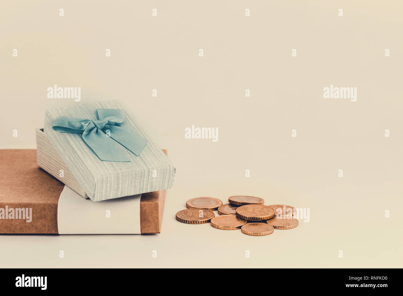 Euro coins and two present boxes on white isolated background Stock ...