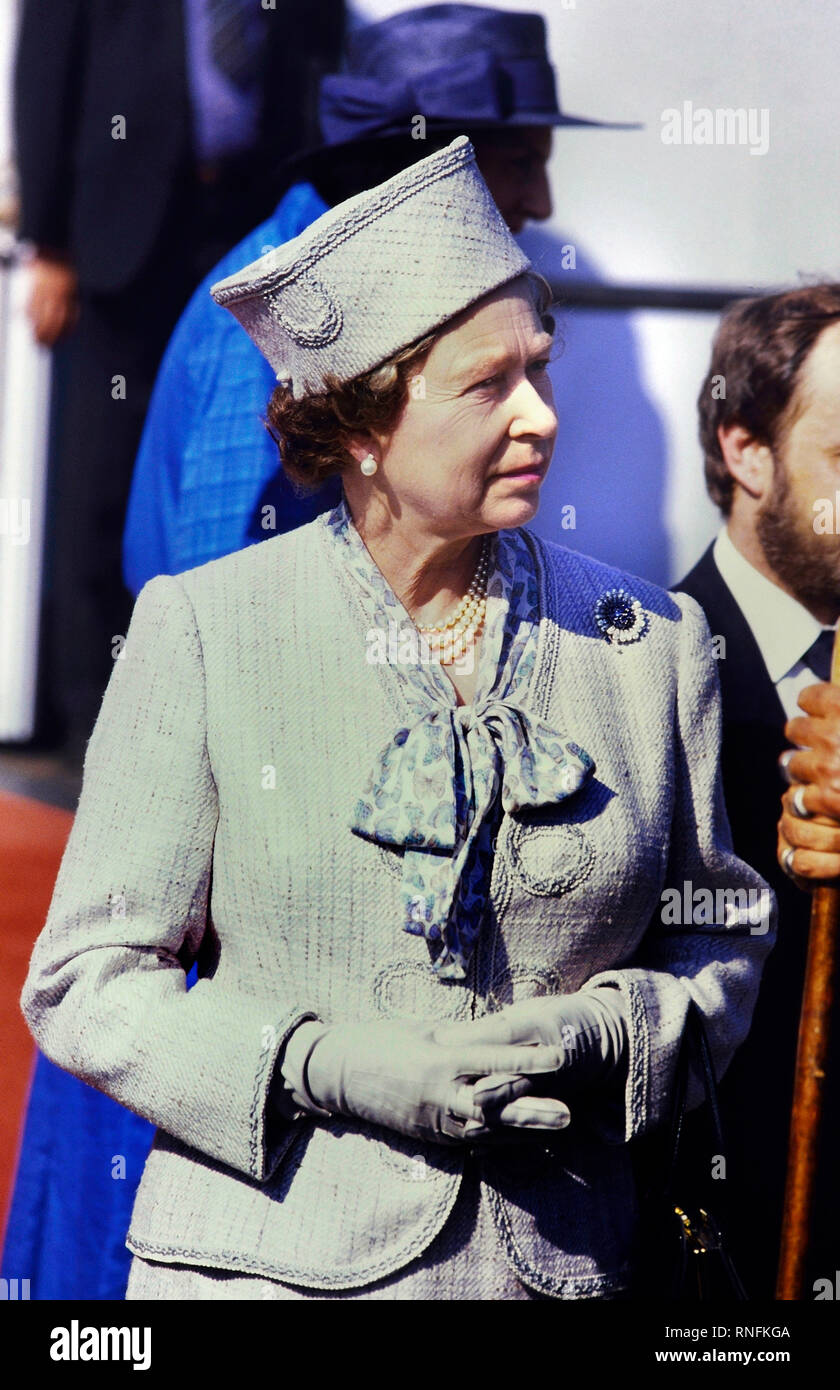 Queen Elizabeth II, wearing a suit designed by fashion designer John ...