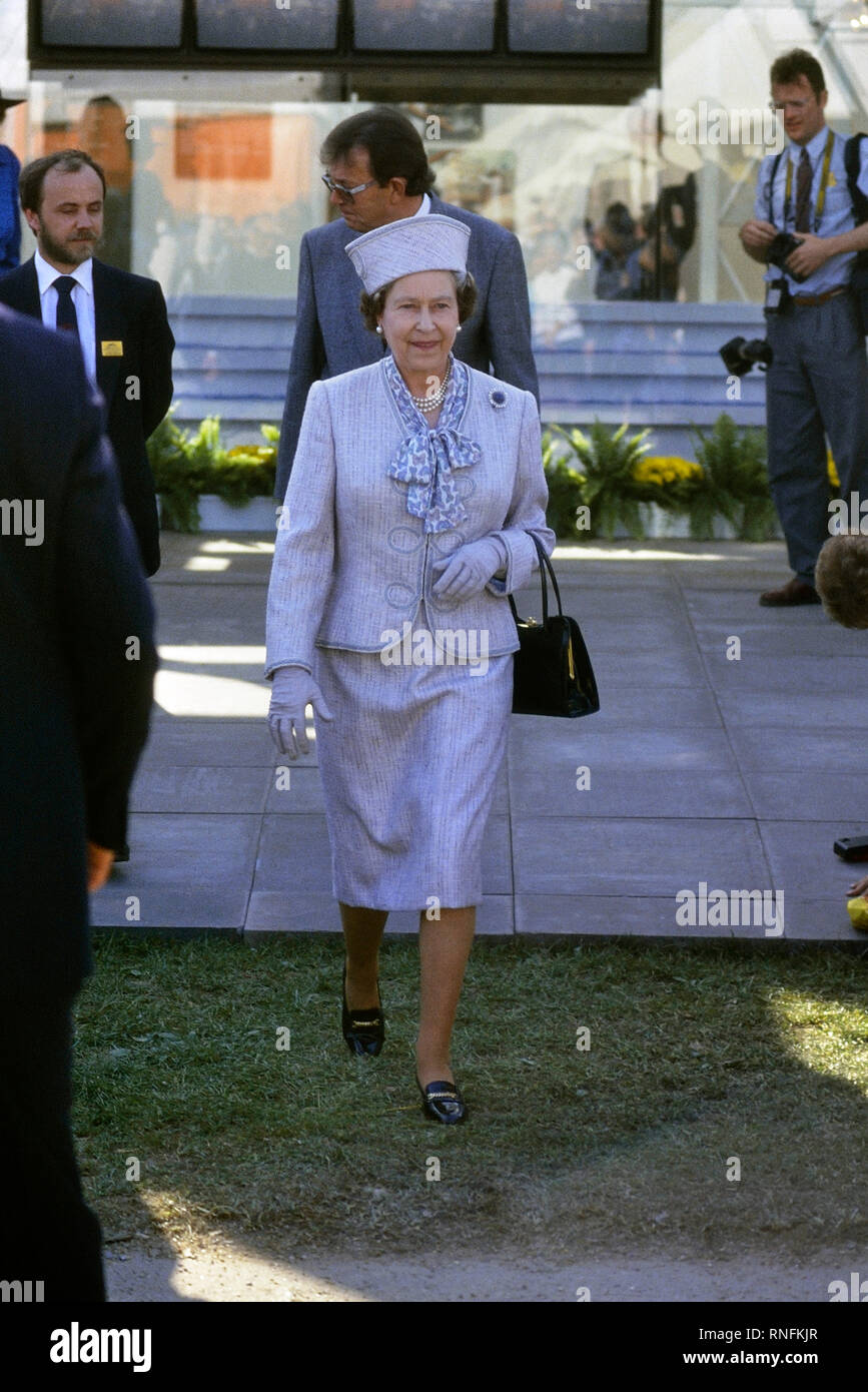 A full length photo of Queen Elizabeth II, wearing a suit designed by ...