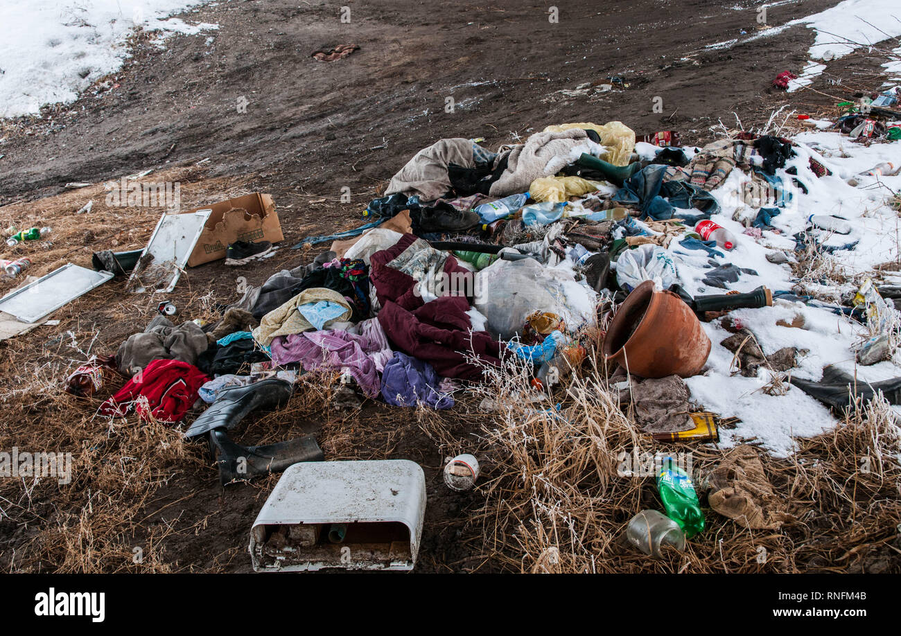 A pile of trash under a bridge, conceptual image of human negligence ...