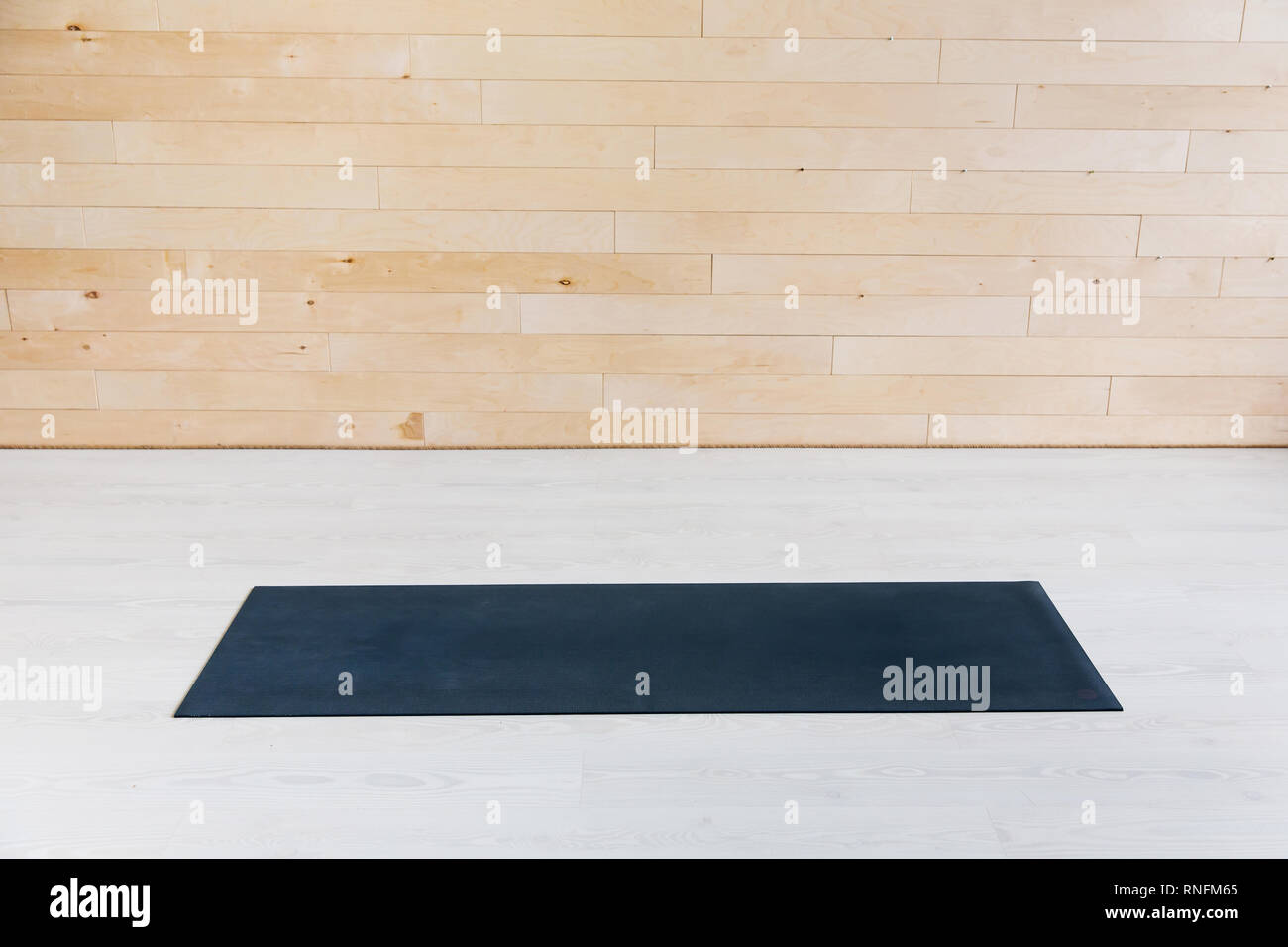 Empty yoga mat on the floor. Equipment for yoga. Concept healthy ...