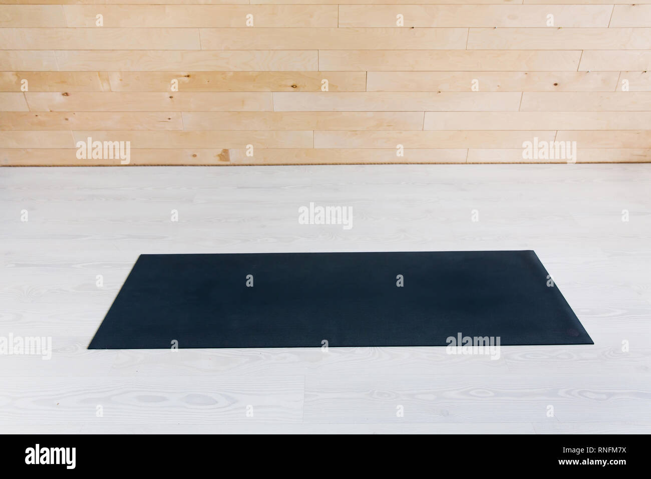 Empty yoga mat on the floor. Equipment for yoga. Concept healthy ...