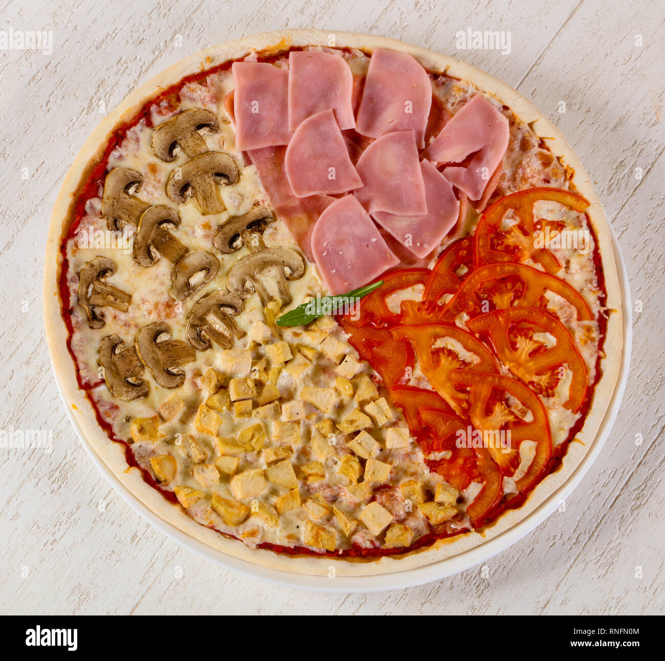 Pizza assortment mix with ham and mushrooms Stock Photo - Alamy