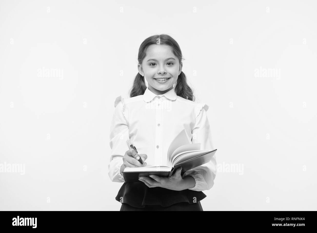 Write note to remember. Child school uniform smart kid happy make note ...