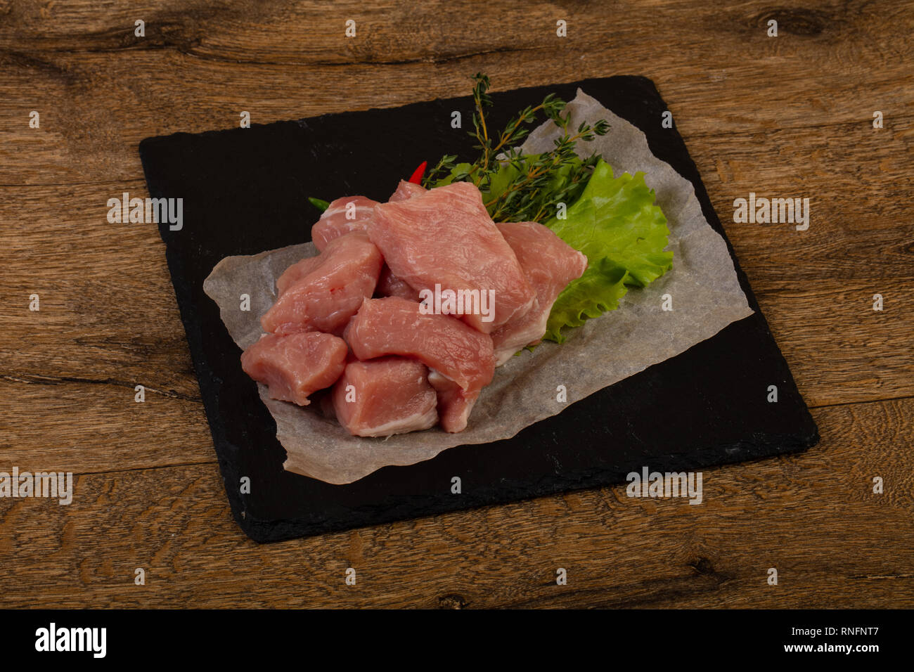 Raw pork meat heap for roast Stock Photo - Alamy