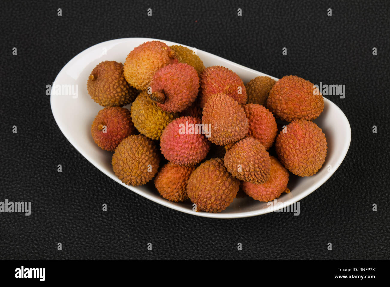 Tropical fruit lychee in the bowl Stock Photo - Alamy