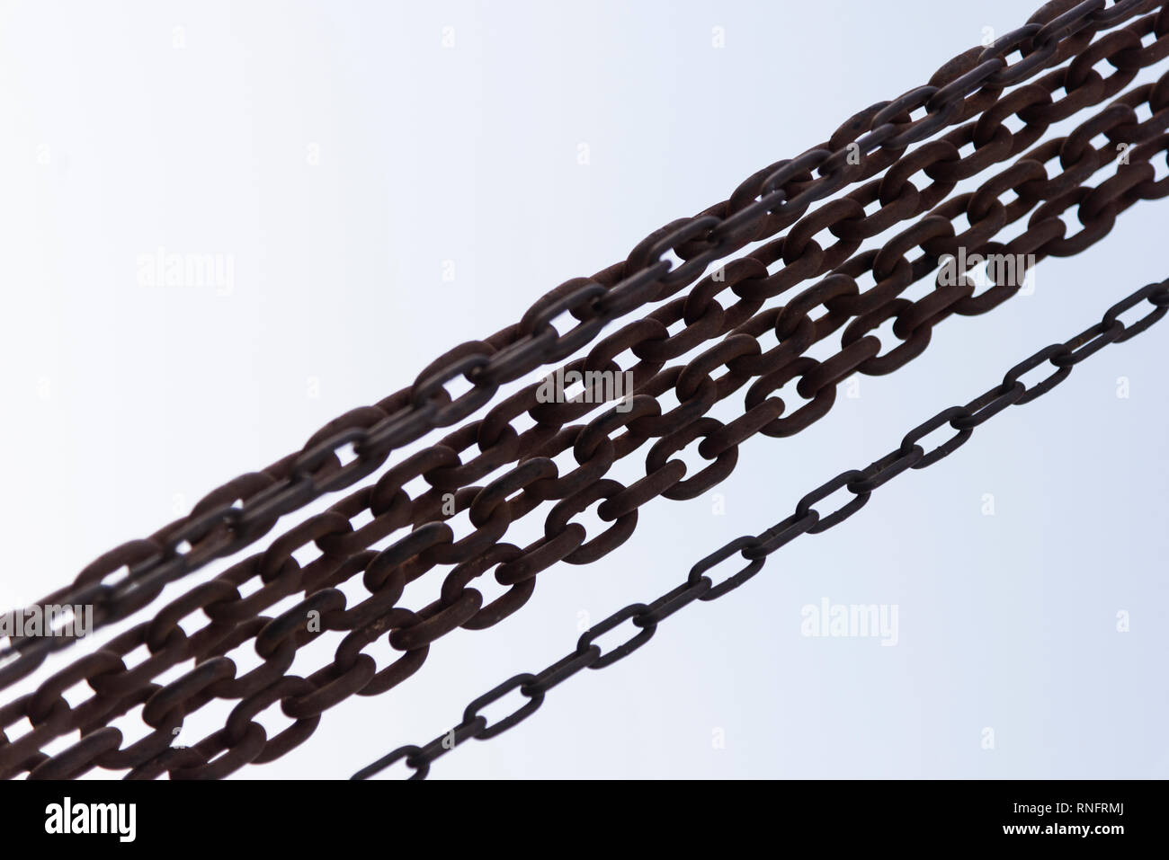 Rusty chains close up shot on a White background Stock Photo - Alamy