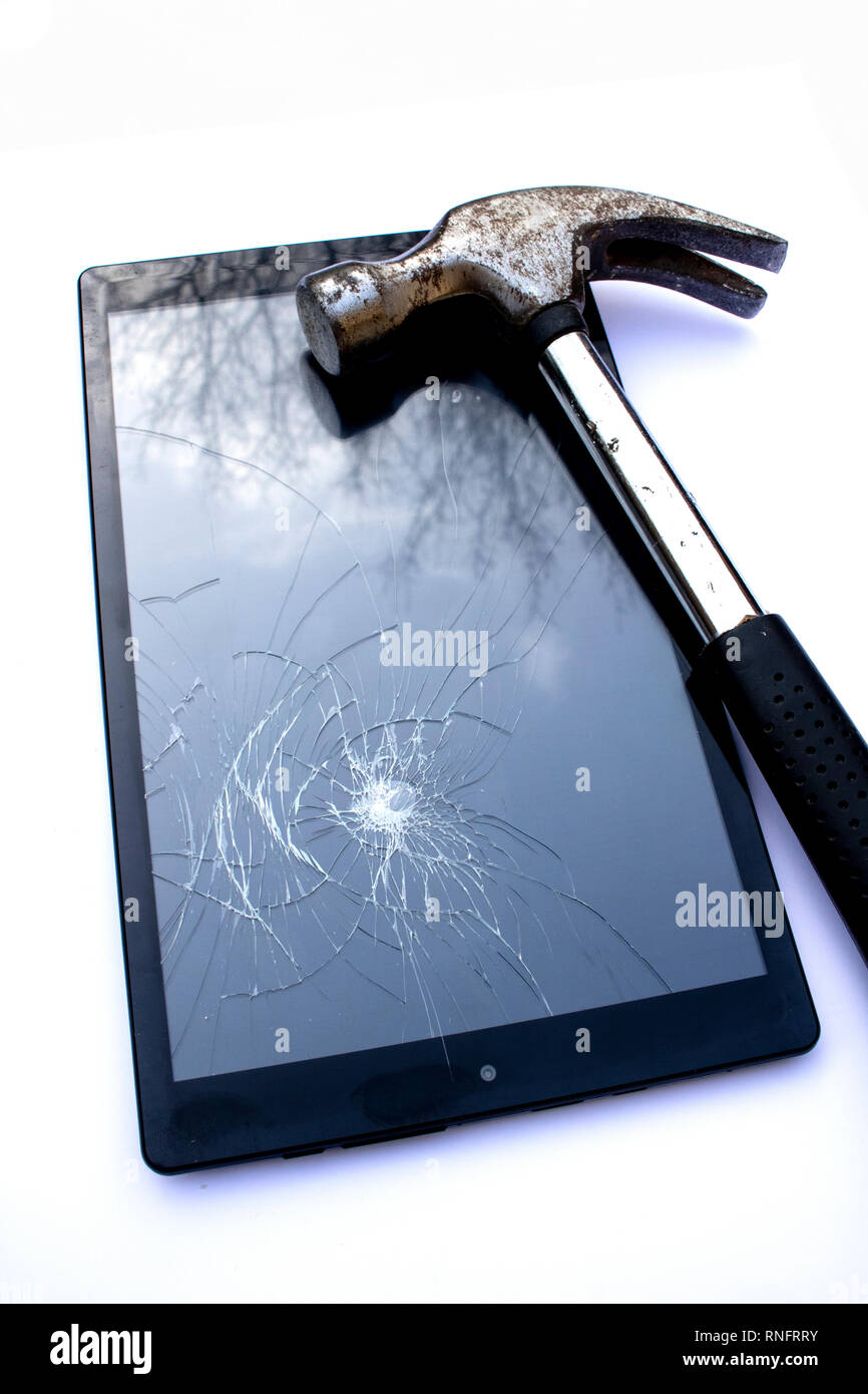 Broken Smart Phone Tablet Mobile Device With hammer on White Background ...