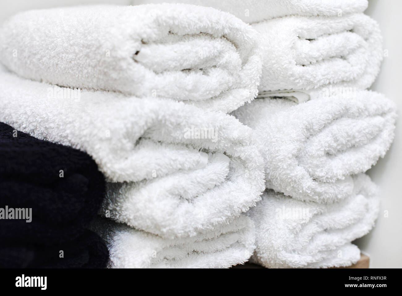 rolls of rolled towels are stacked. spa complex Stock Photo - Alamy