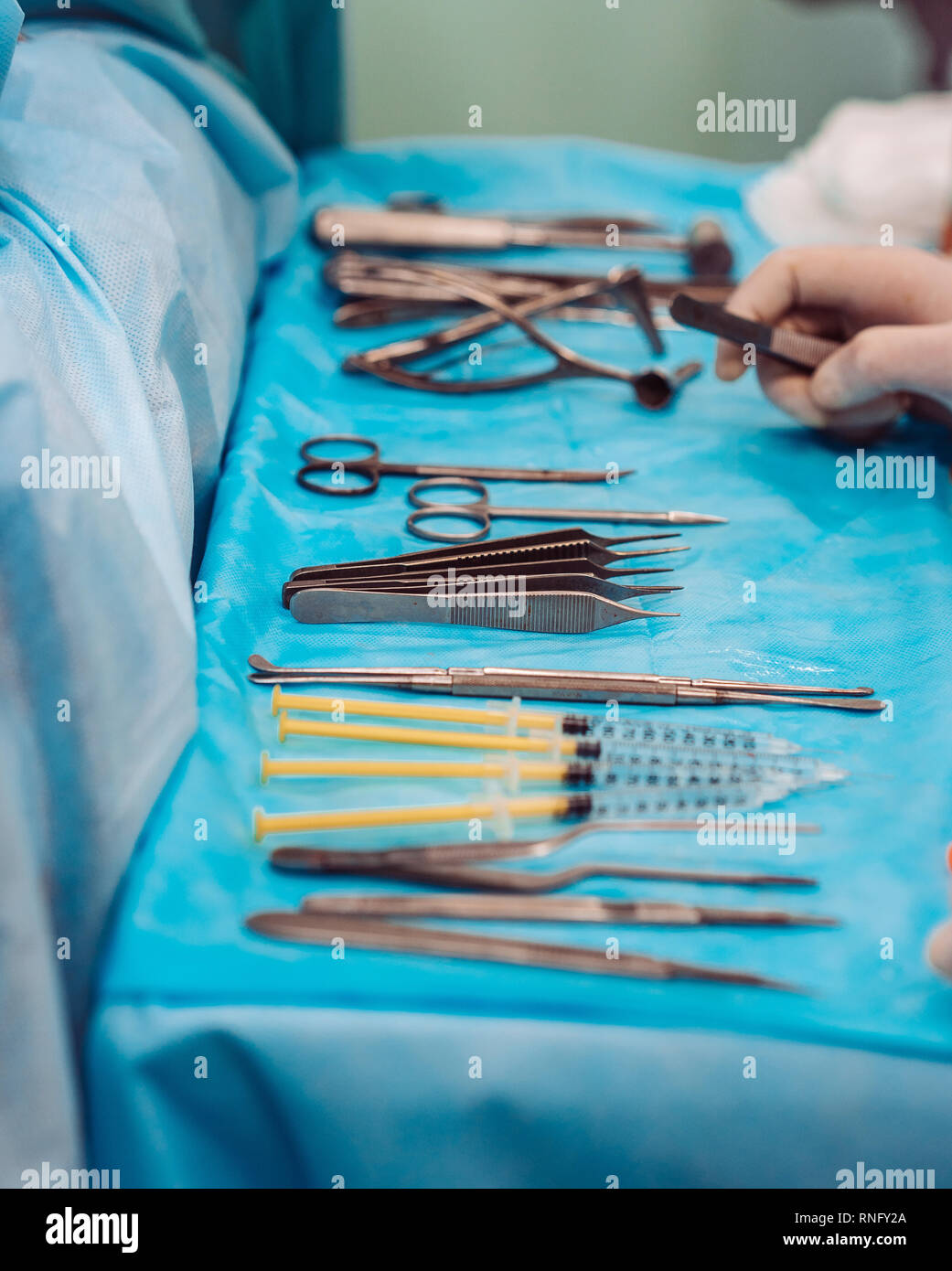 Scrub nurse preparing medical instruments for operation Stock Photo - Alamy