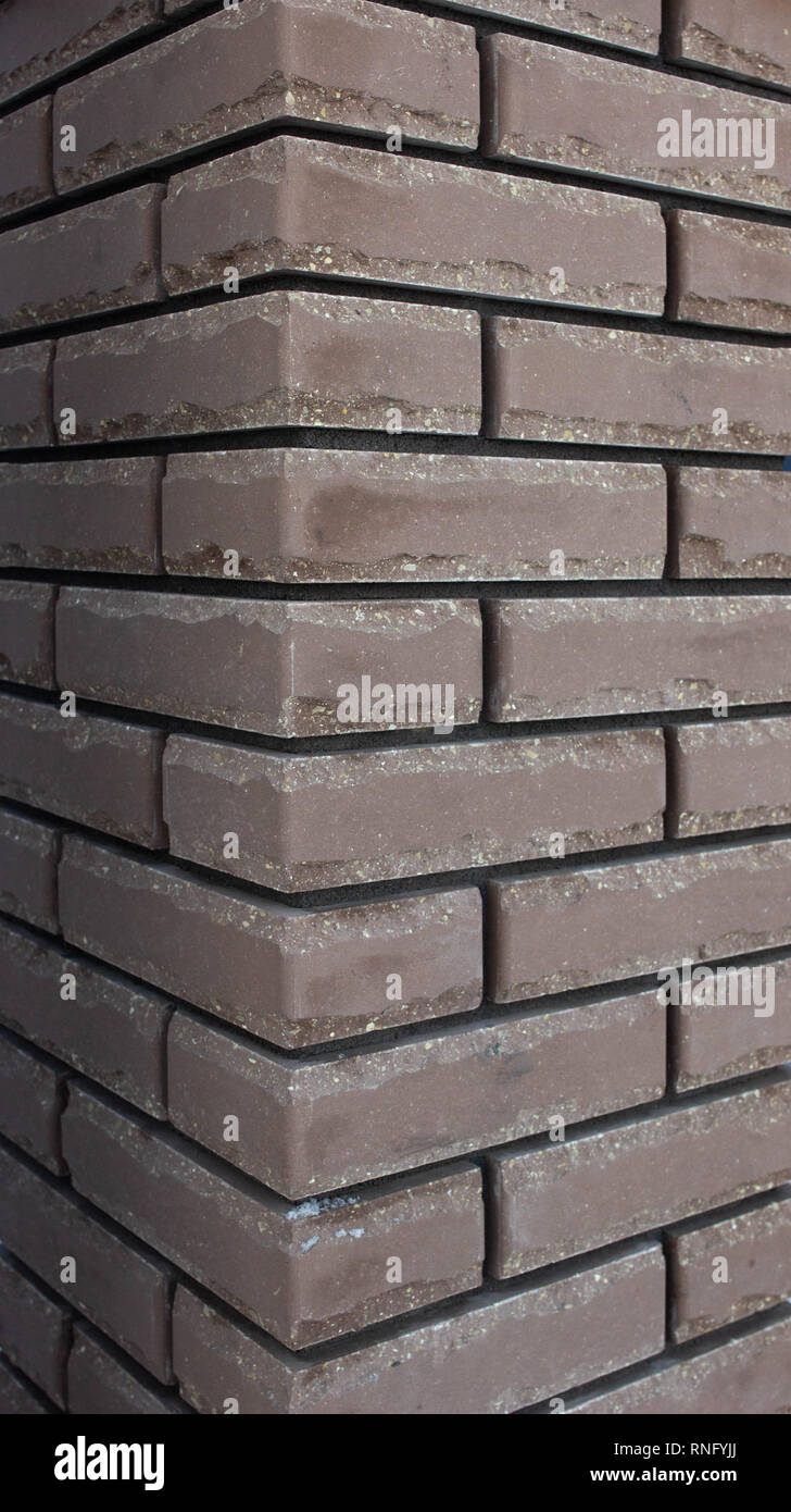 Brown modern brick column, background texture Stock Photo - Alamy