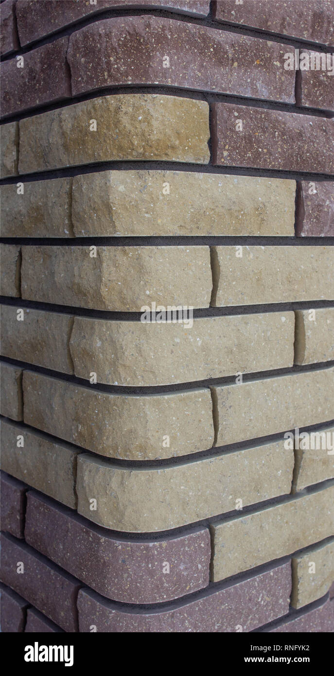 Modern brick column with brown and gray bricks, designer, texture ...
