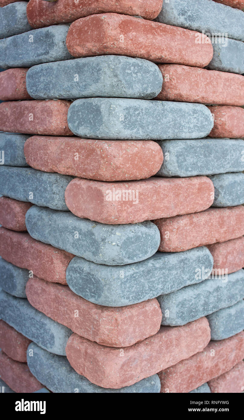 Multicolored modern brick column with red, close-up, texture, backdrop ...