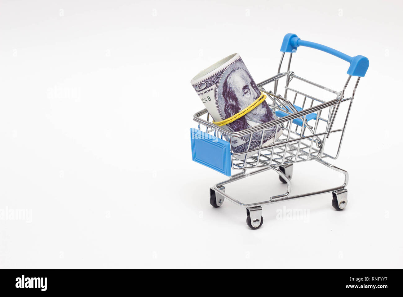 Money dollars in shopping trolley on white background, concept of ...