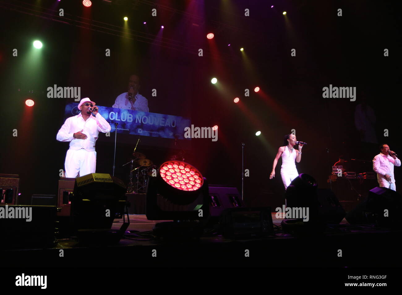 Club Nouveau are shown performing on stage during a "live" concert ...