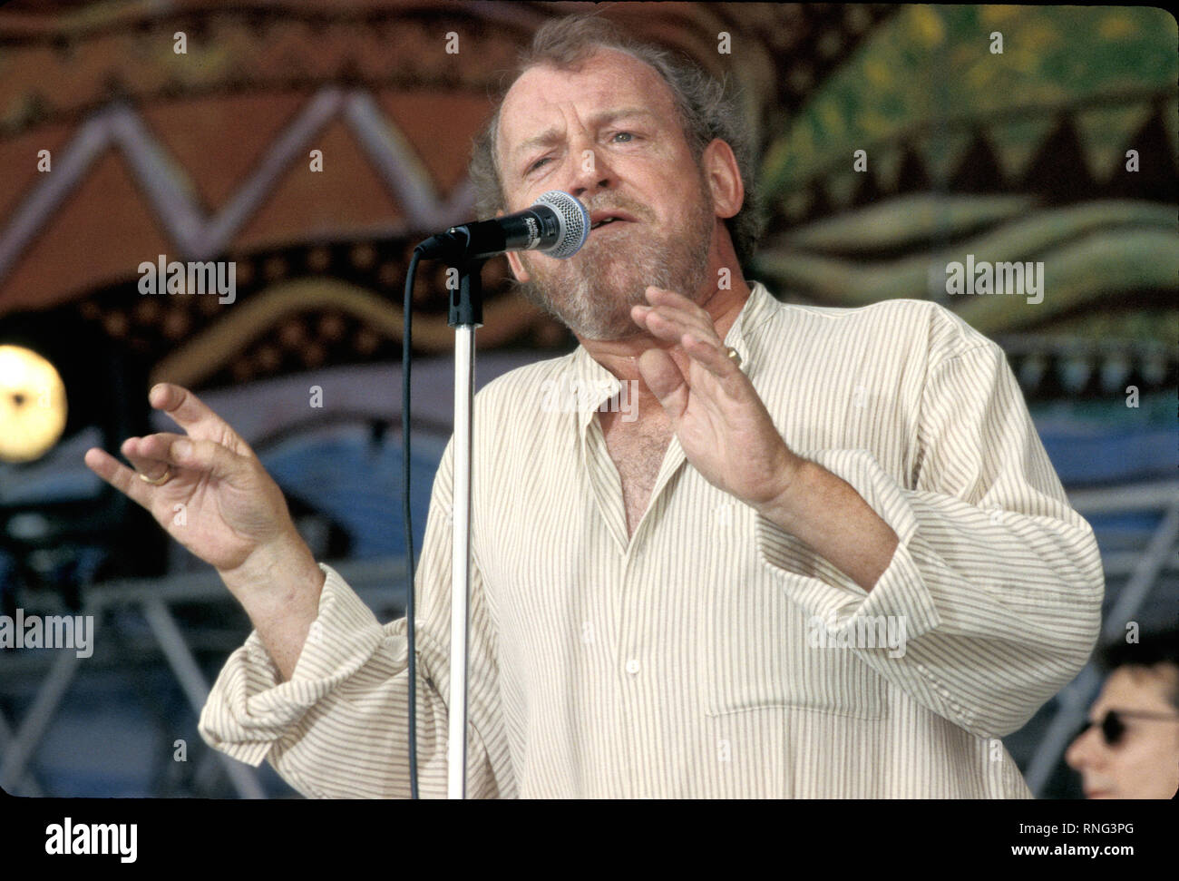 English rock and blues singer Joe Cocker is shown on stage performing ...
