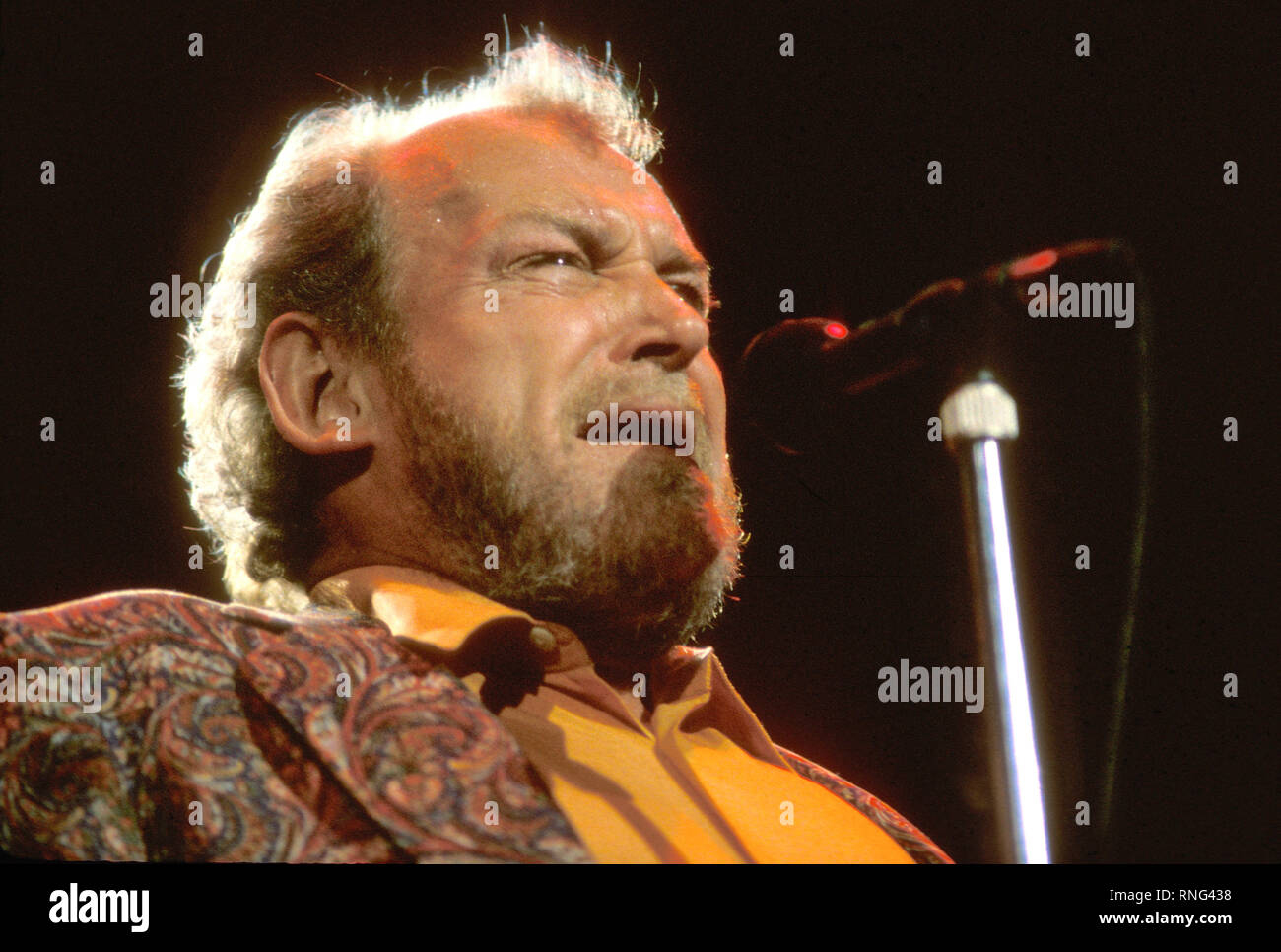 English rock and blues singer Joe Cocker is shown on stage performing ...
