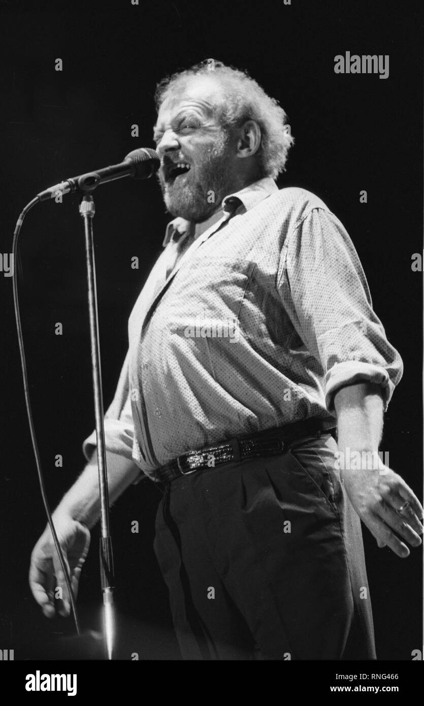Singer Joe Cocker is shown performing on stage during a "live" concert ...