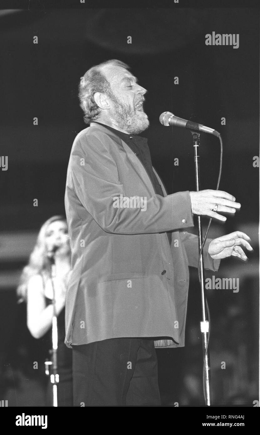 Singer Joe Cocker is shown performing on stage during a "live" concert ...