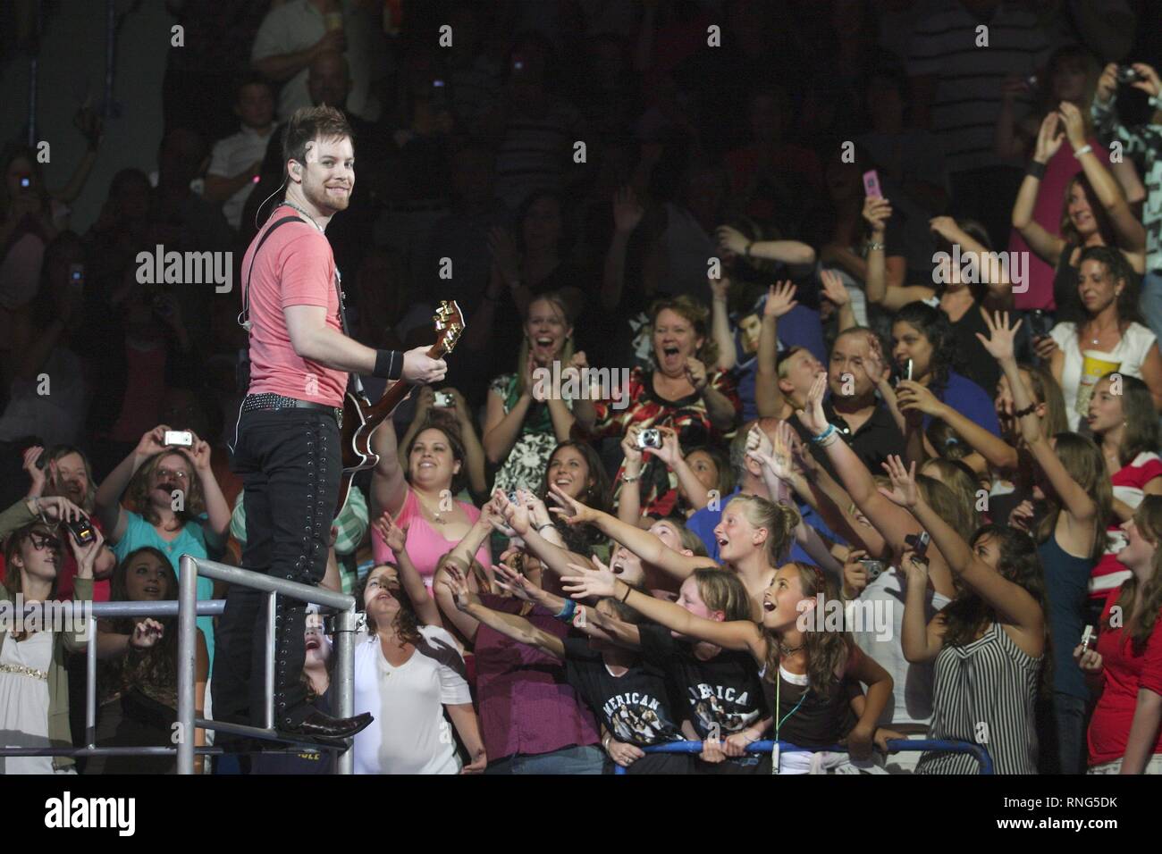 American Idol winner David Cook is shown performing on stage during a ...