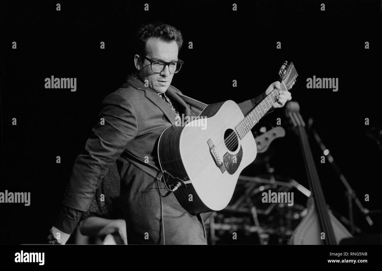 Singer and songwriter Elvis Costello is shown performing on stage ...