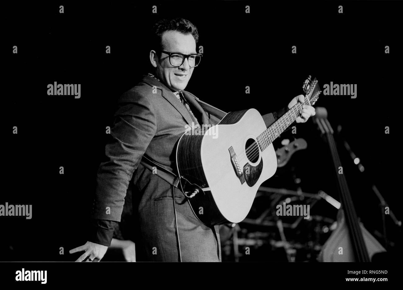 Singer and songwriter Elvis Costello is shown performing on stage ...