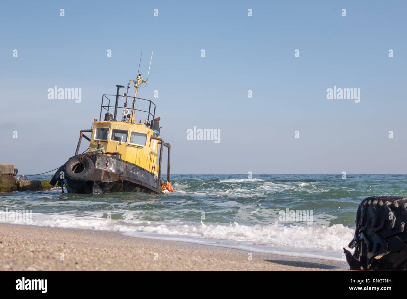 Stranded sea tug on the beach on a spring sunny day Stock Photo - Alamy