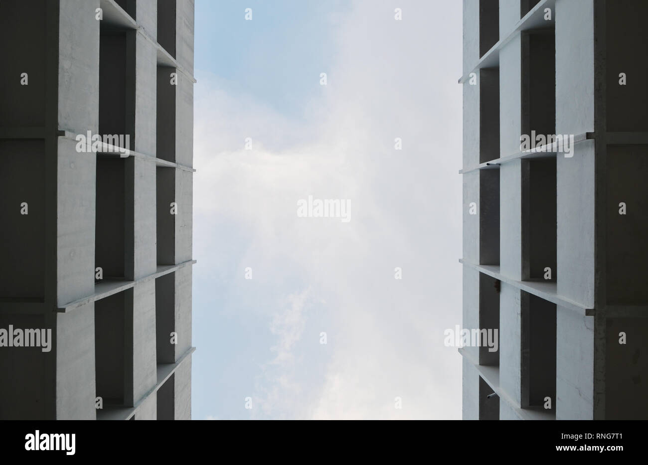 Low-angle view of a tall commercial building under construction against ...