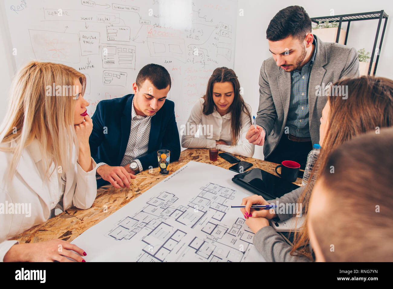 Urban working people are looking at the sketch they are making Stock ...