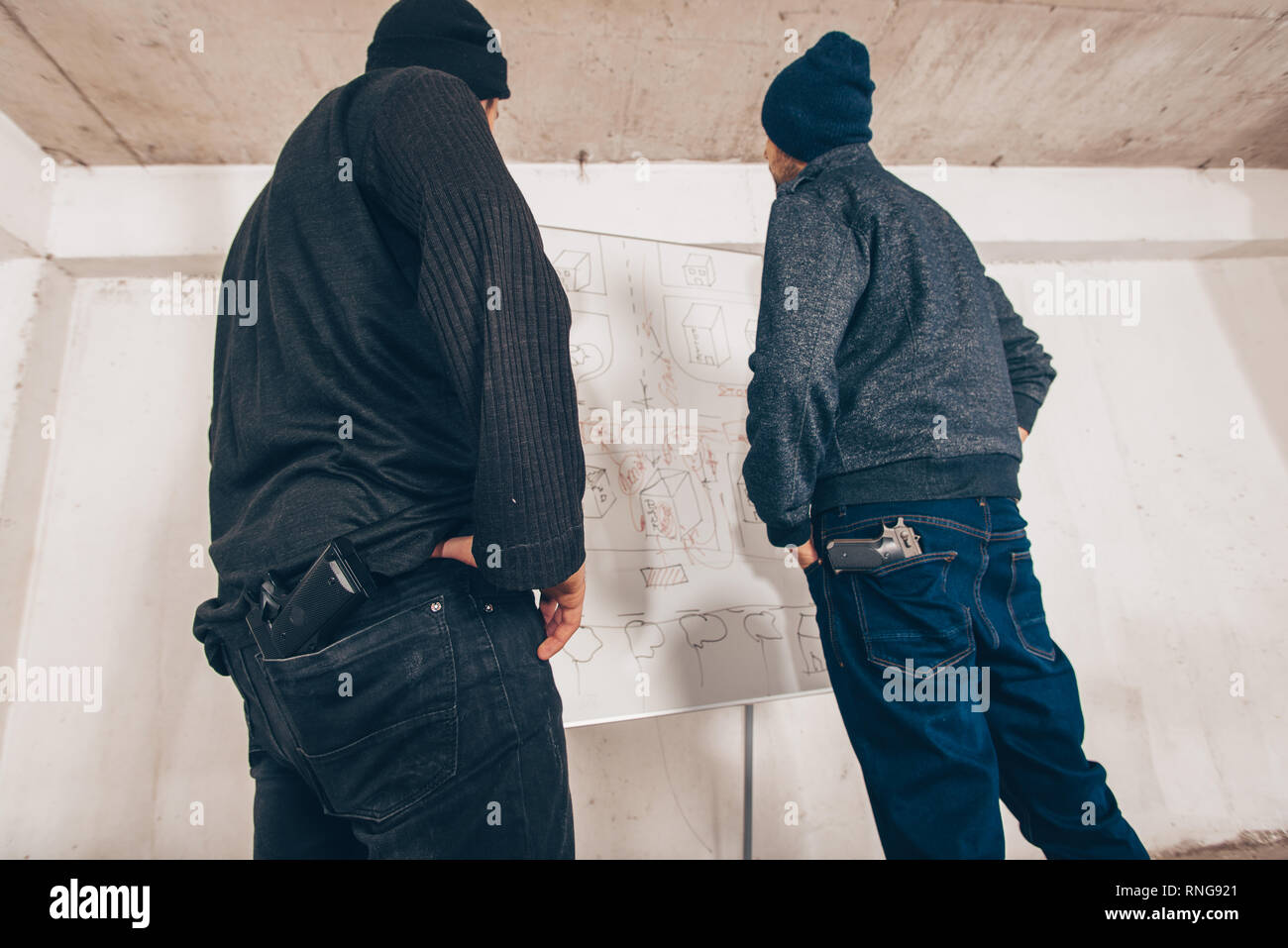 Stealers are drawing a plan for crime on the map in basement Stock ...
