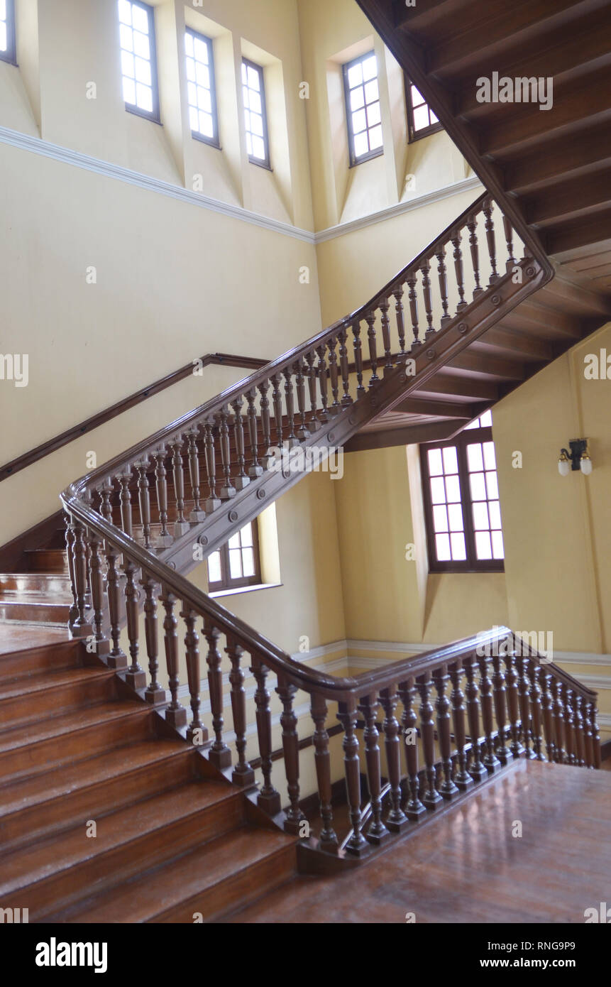 Winding wood staircase in building Stock Photo - Alamy