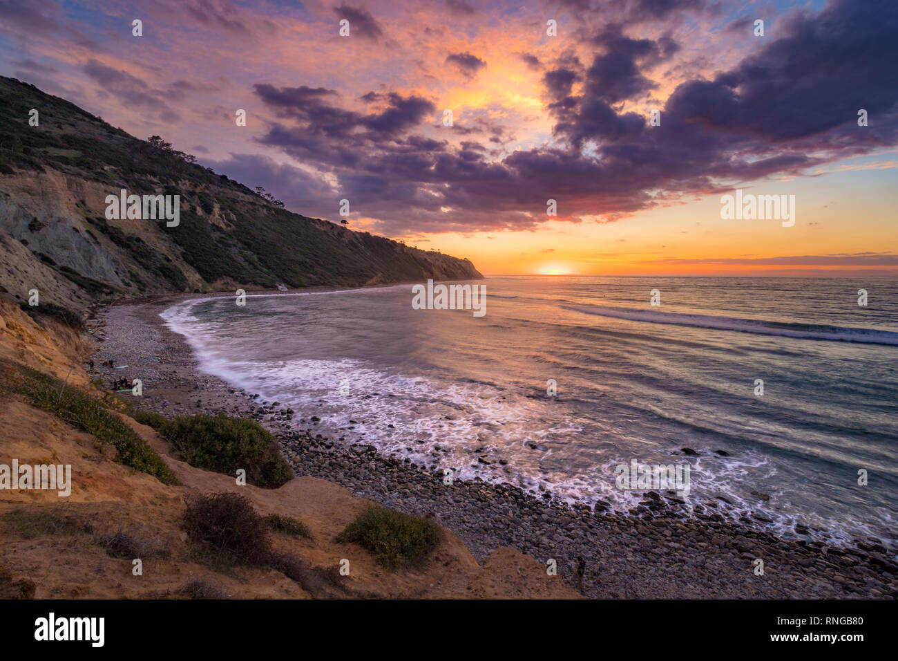 Peaceful rock sand cliff coast rugged sky clouds hi-res stock ...