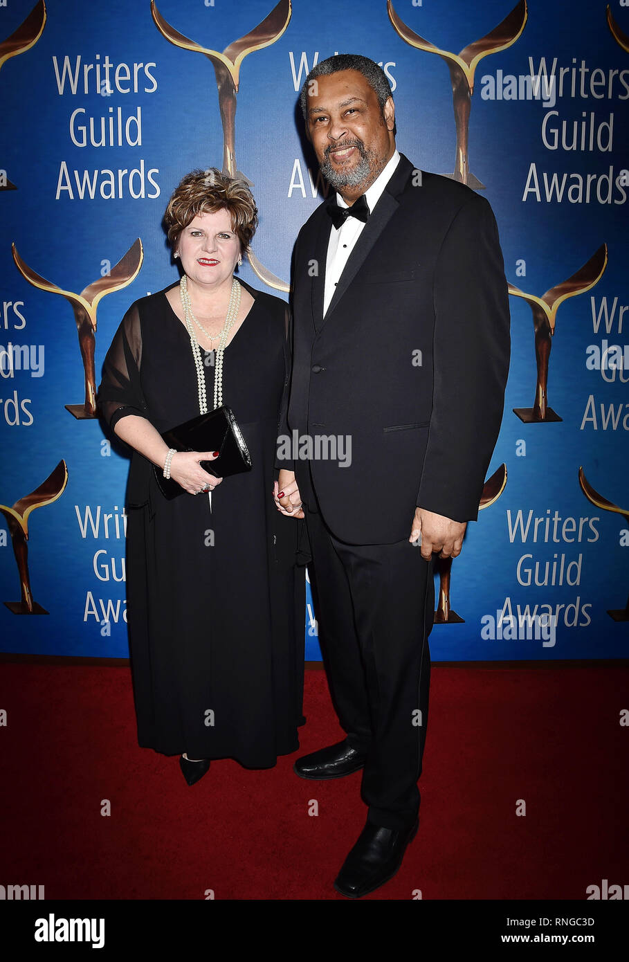 BEVERLY HILLS, CA - FEBRUARY 17: Kevin Willmott (R) and guest attend ...