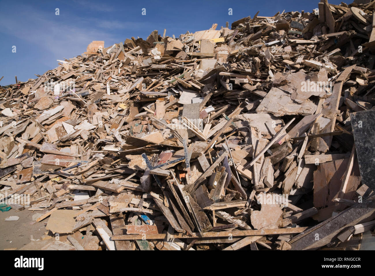 Pile of discarded wooden debris in a recycling yard Stock Photo - Alamy