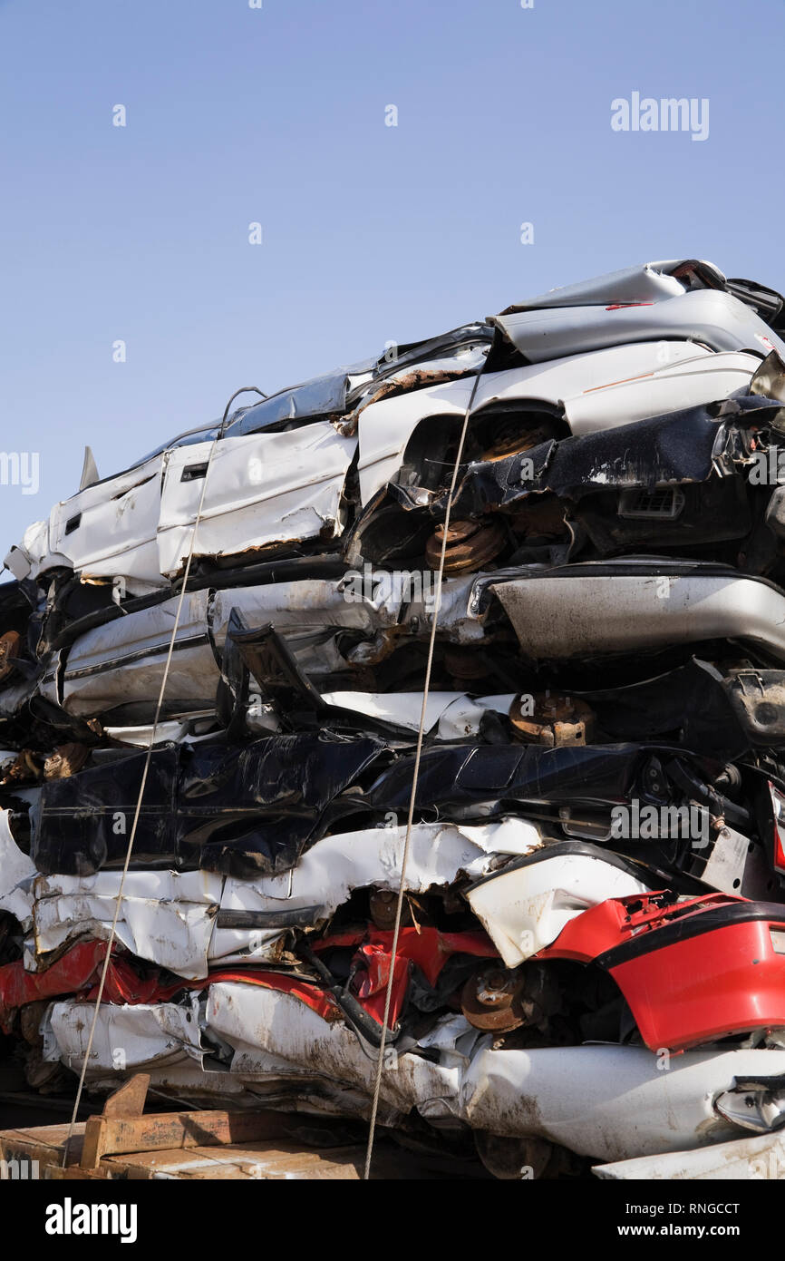 Tied stack of crushed automobiles on a flatbed transportation truck ...