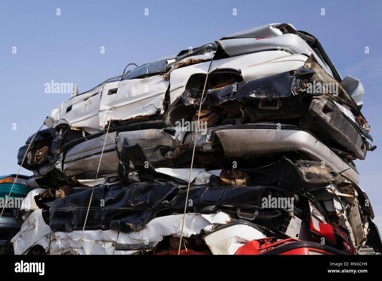 Tied stack of crushed automobiles on a flatbed transportation truck ...