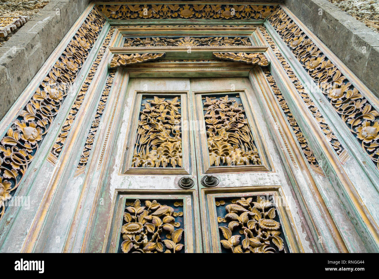 Balinese wood carved doors with traditional local ornaments. Local ...