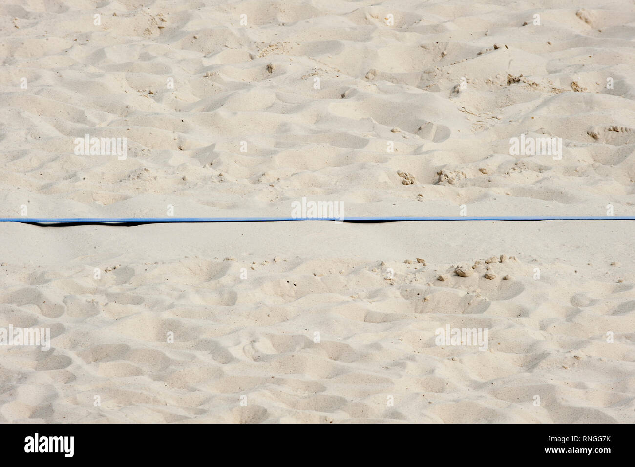 Corner of blue border line in beach volleyball Stock Photo - Alamy