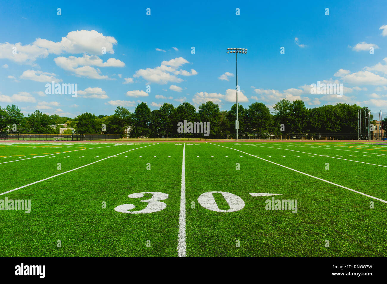 Soccer ball on the field of stadium Stock Photo - Alamy