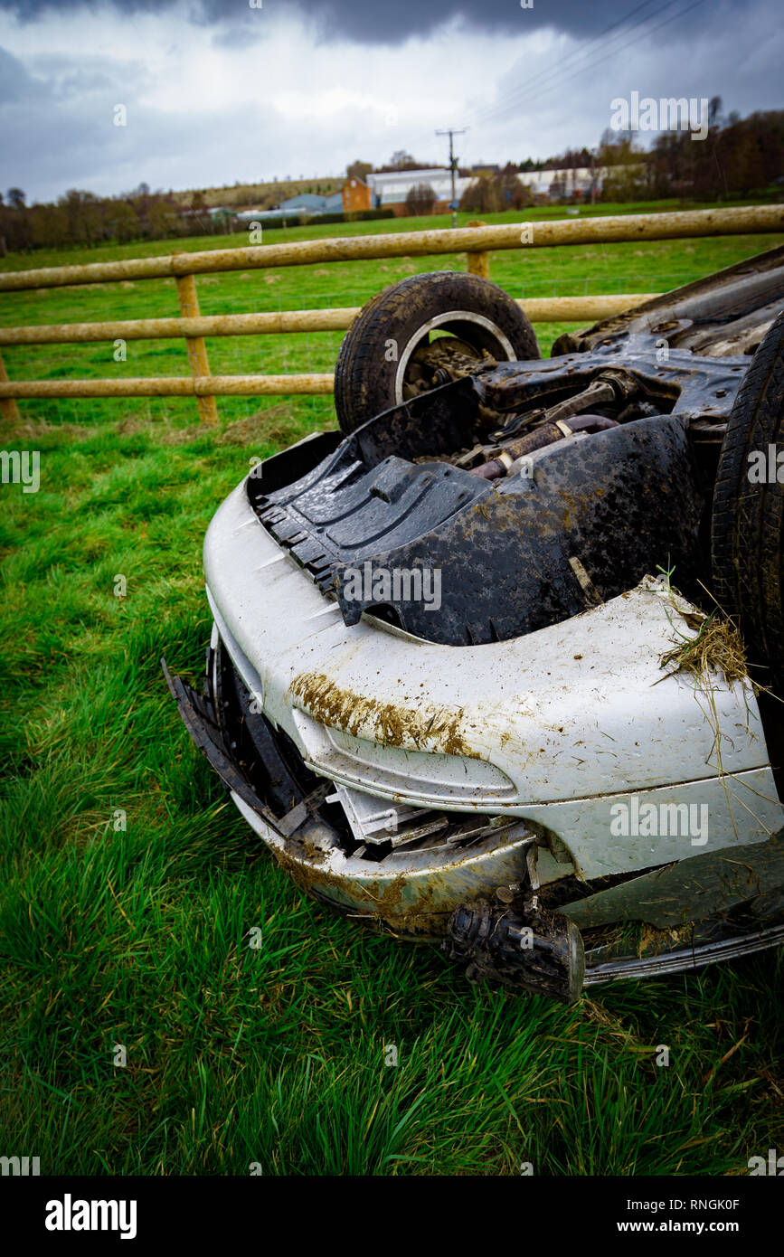 Car Crash and Car Damage. Vehicle rolled over in a field after a high ...