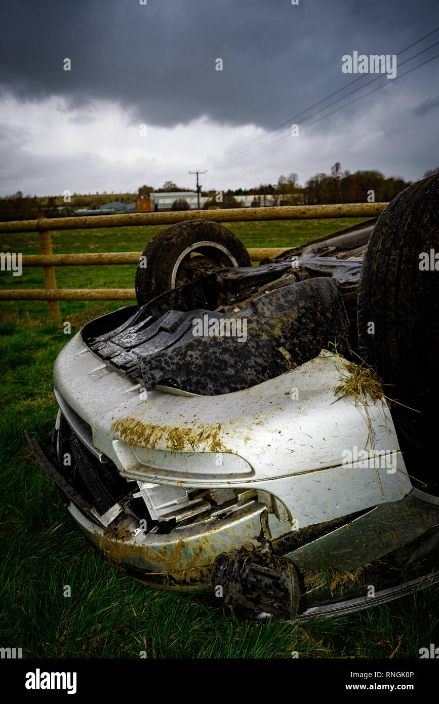 Car Crash and Car Damage. Vehicle rolled over in a field after a high ...